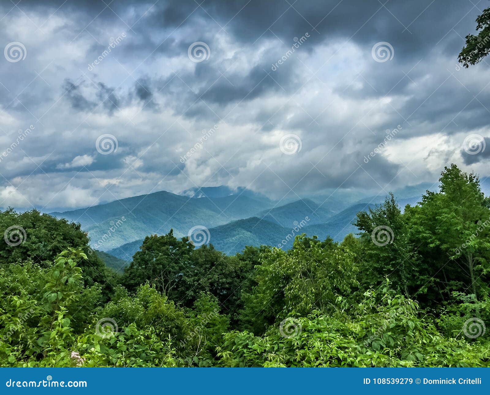 Dramatic Sky Over Distant Blue Mountains Stock Image - Image of flow ...