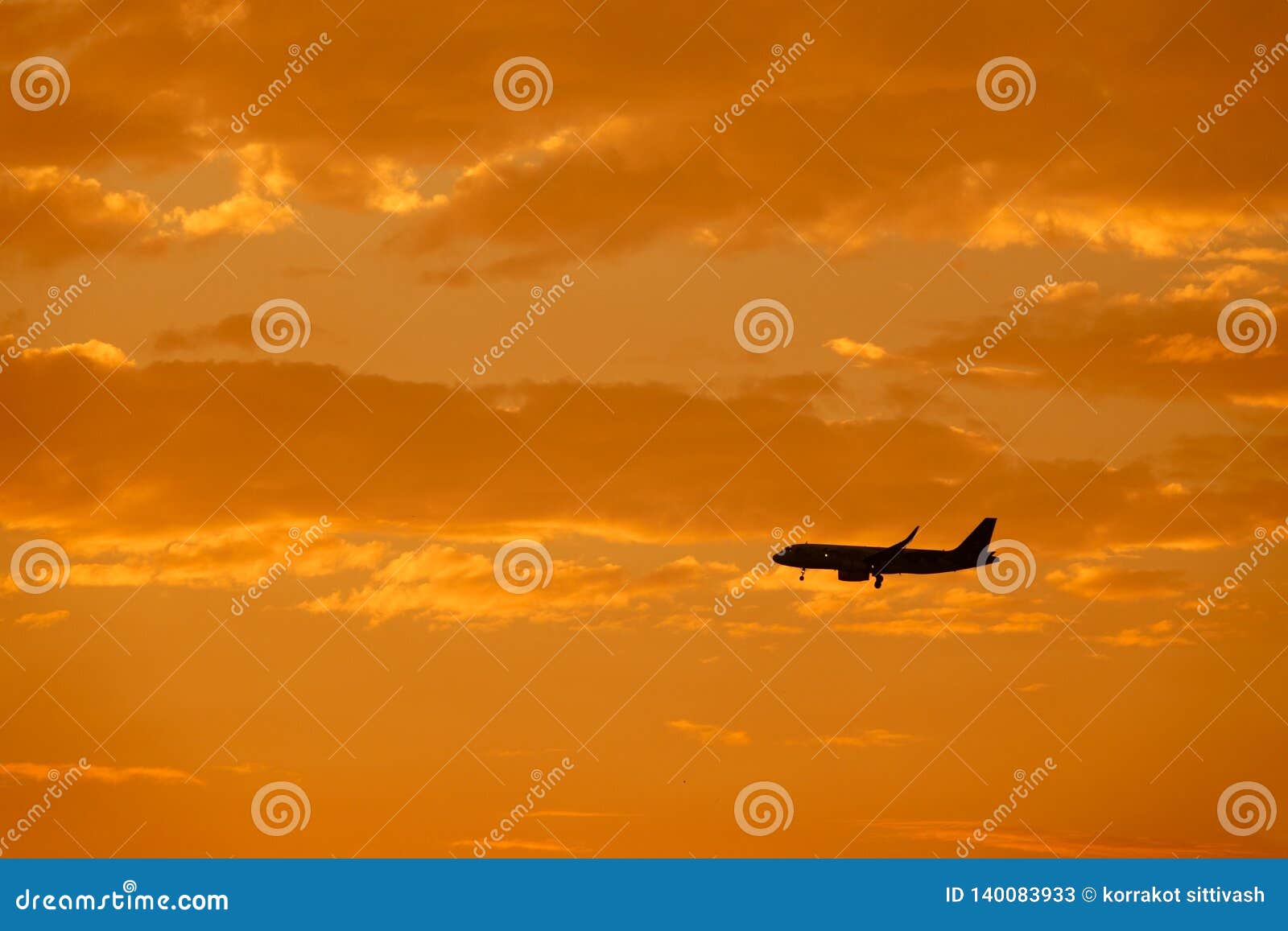 Dramatic Sky and Silhouette of the Landing Plane on a Sunset Stock ...