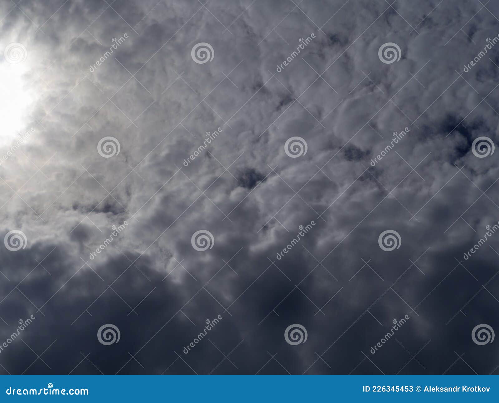 A Dramatic Sky with a Solid Cloud Cover through Which Sunlight Breaks ...