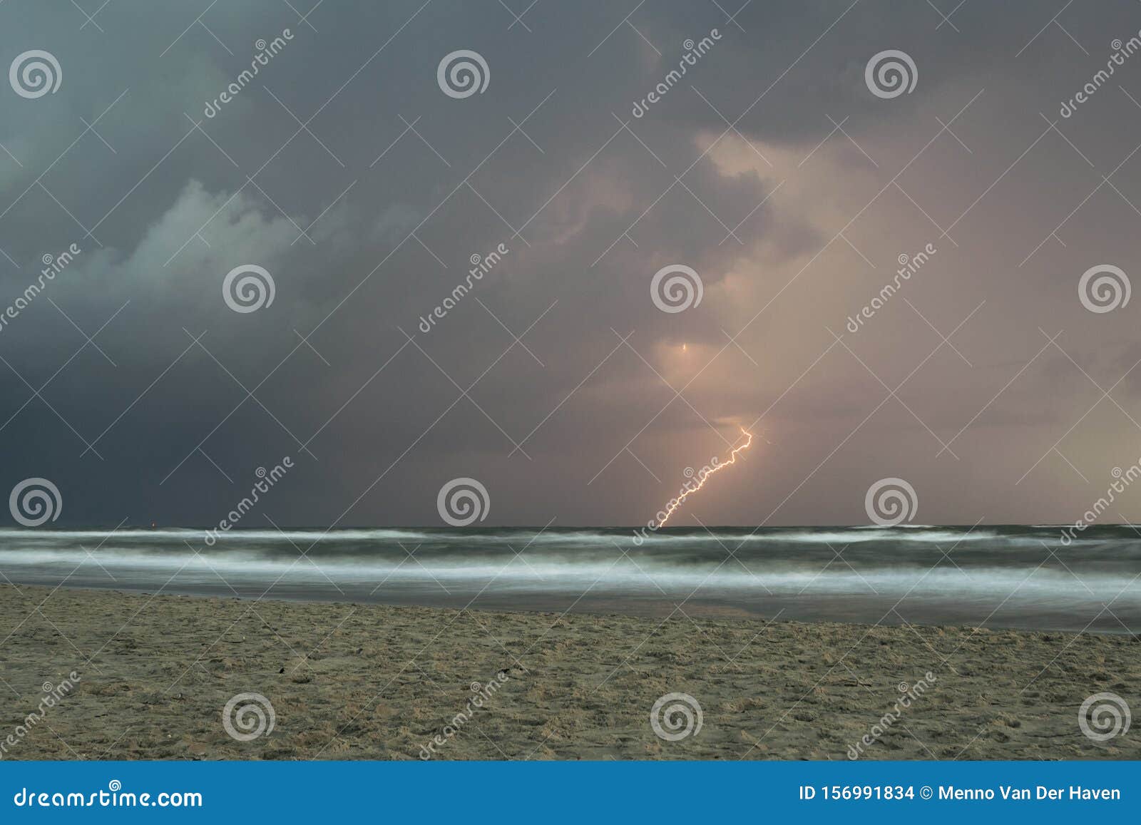Lightning Bolt Strikes in the Water from a Thunderstorm Over Sea Stock ...