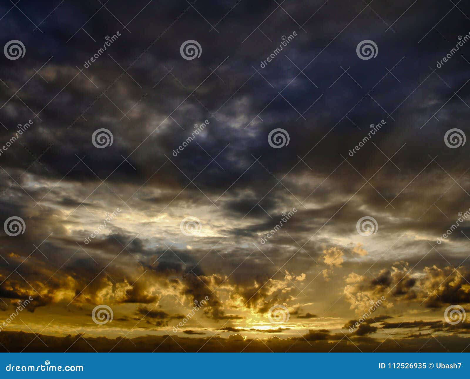 Dramatic Sky with Sun Rays Seep through Clouds during Sunset Stock ...