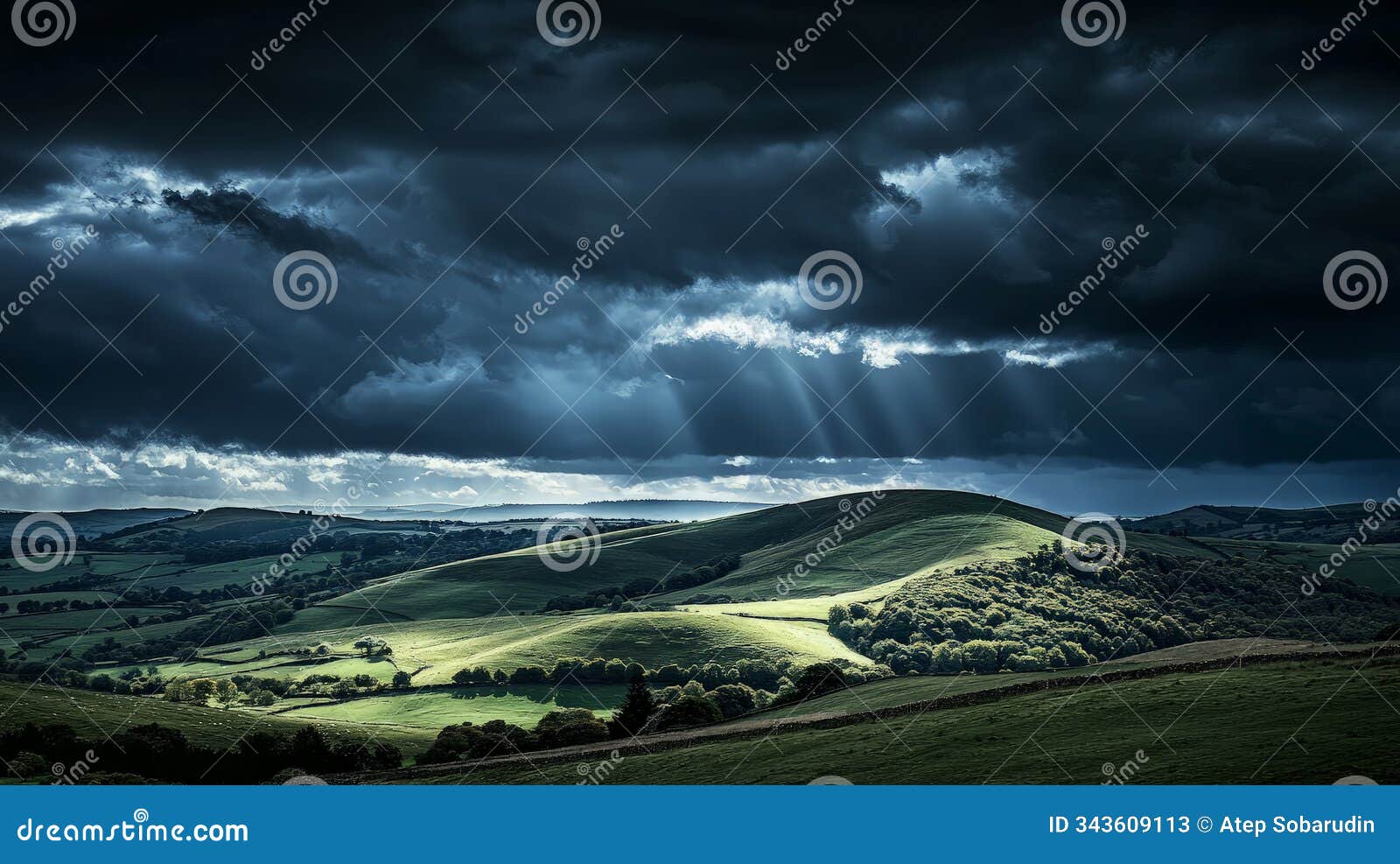 Dramatic Sky with Sun Rays Shining through Dark Clouds Over Rolling ...