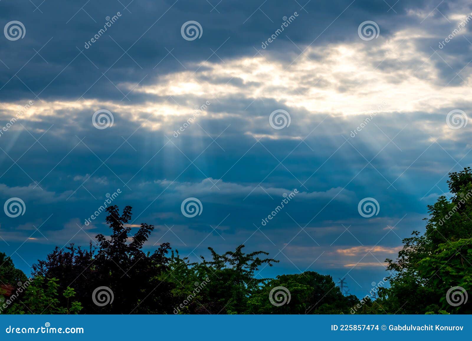 Dramatic Sky with Sun Rays at Sunset, Green Trees Stock Photo - Image ...