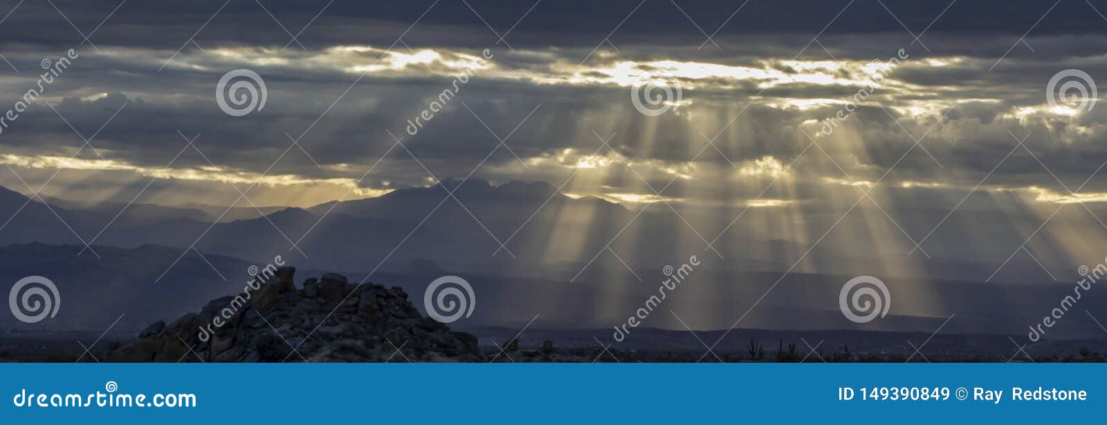 Dramatic Sun Rays Beaming Down on Mountains Stock Image - Image of ...