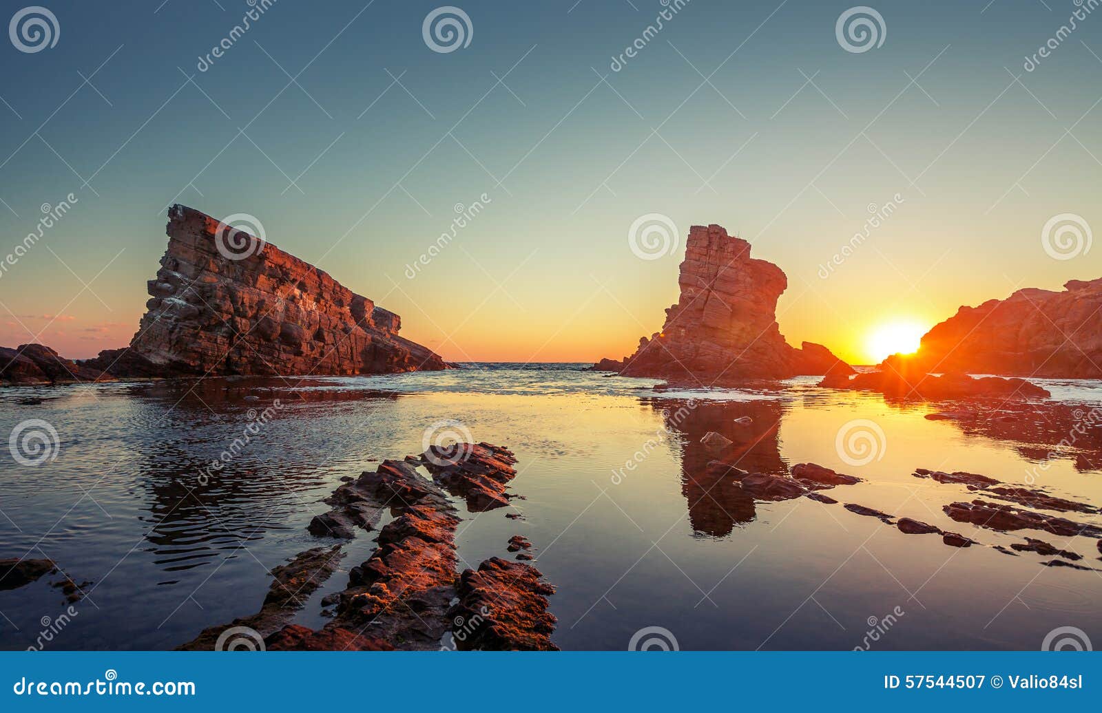 Dramatic Sunrise with Mist on the Beach with Rocks Stock Image - Image ...