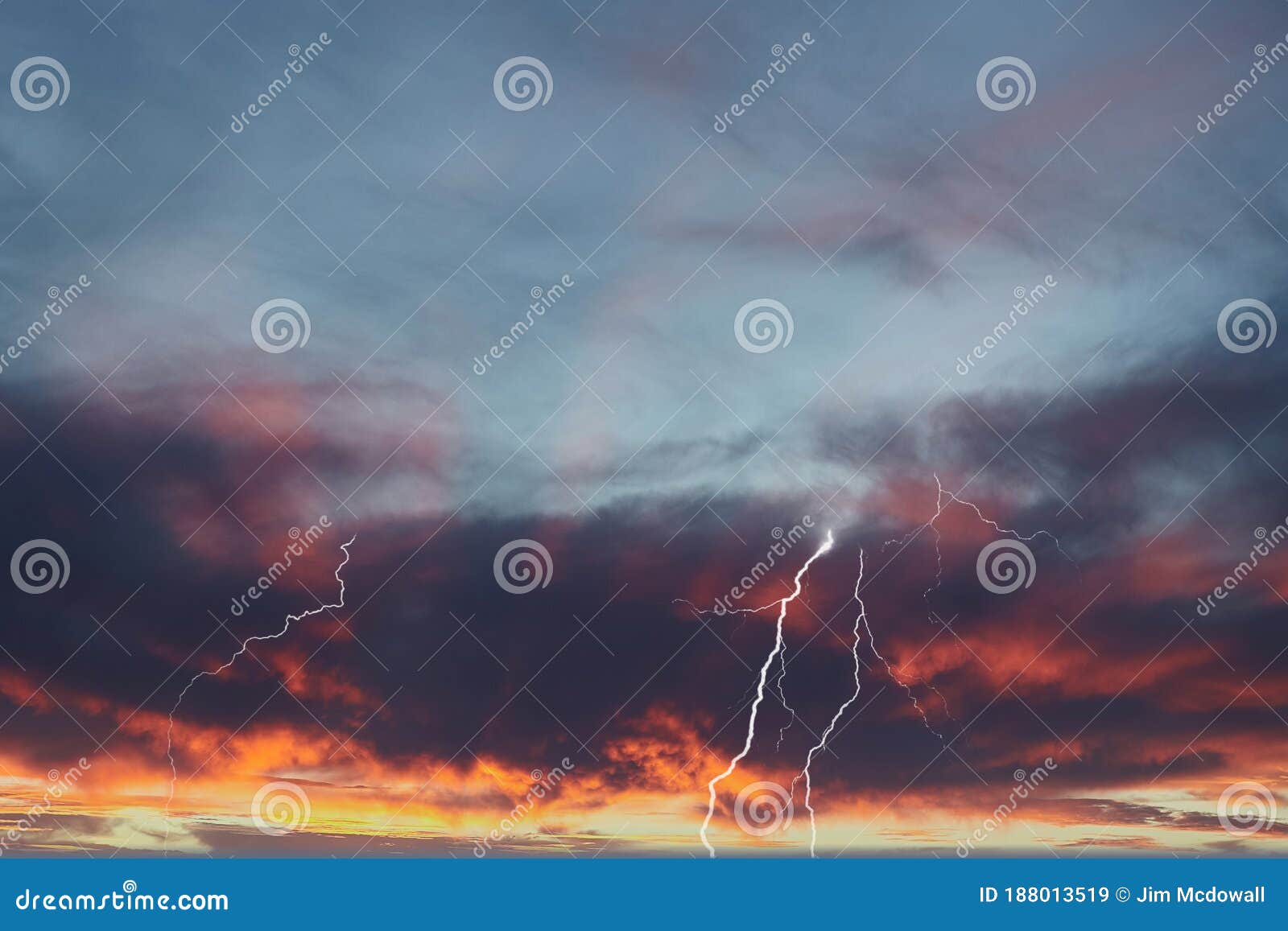 Dramatic Sunset with Blazing Red Sky and Ribbon Lightning Stock Image ...