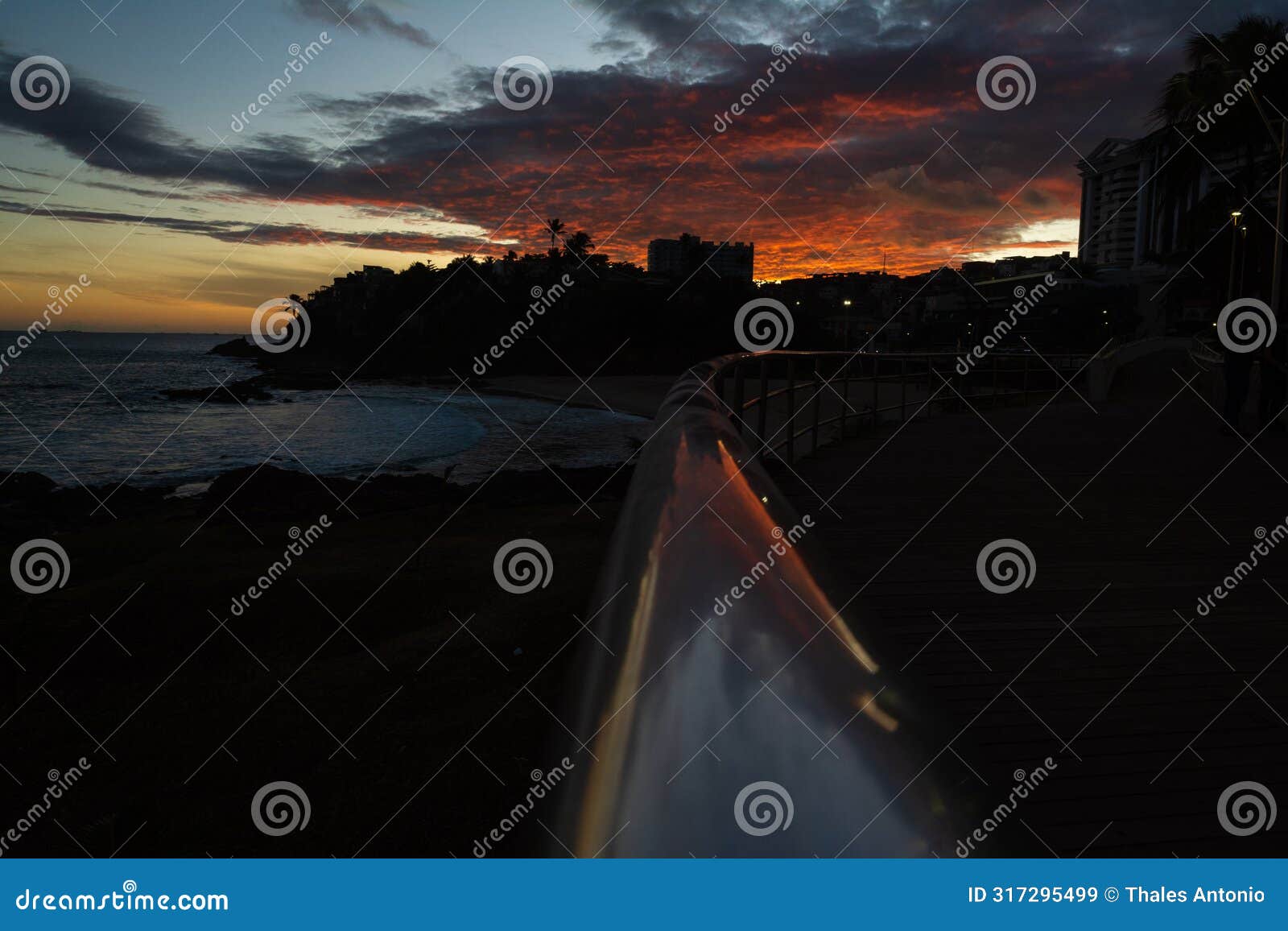 Dramatic Sunset with Colorful Clouds and Silhouette of Waterfront ...