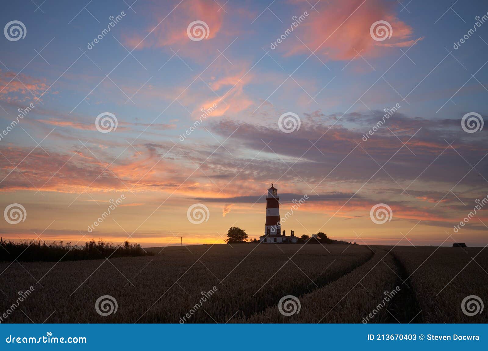 Lighthouse in a Field of Wheat on the Norfolk Coast during a Dramatic ...