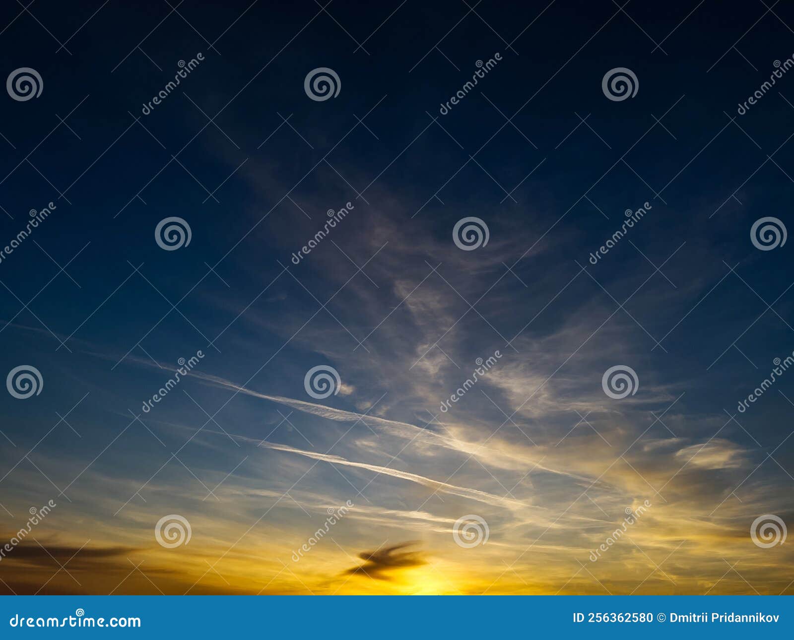 Dramatic Sunset with Orange Clouds and the Sun Behind the Clouds Stock ...