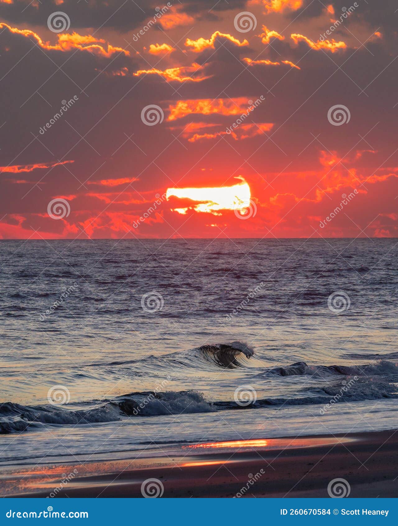 Dramatic Sunset Over the Ocean As the Sun Dips Below the Horizon Though ...