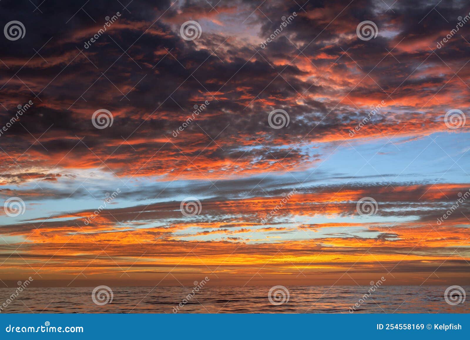 Dramatic sunset over ocean stock image. Image of sundown - 254558169