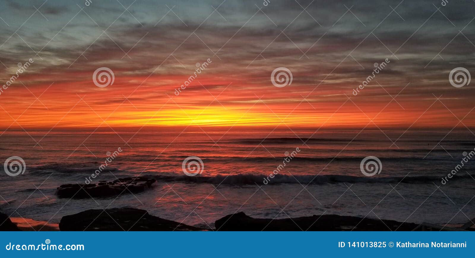Dramatic Sunset Over Pacific Ocean - Waves Crashing on the Rocks Stock ...