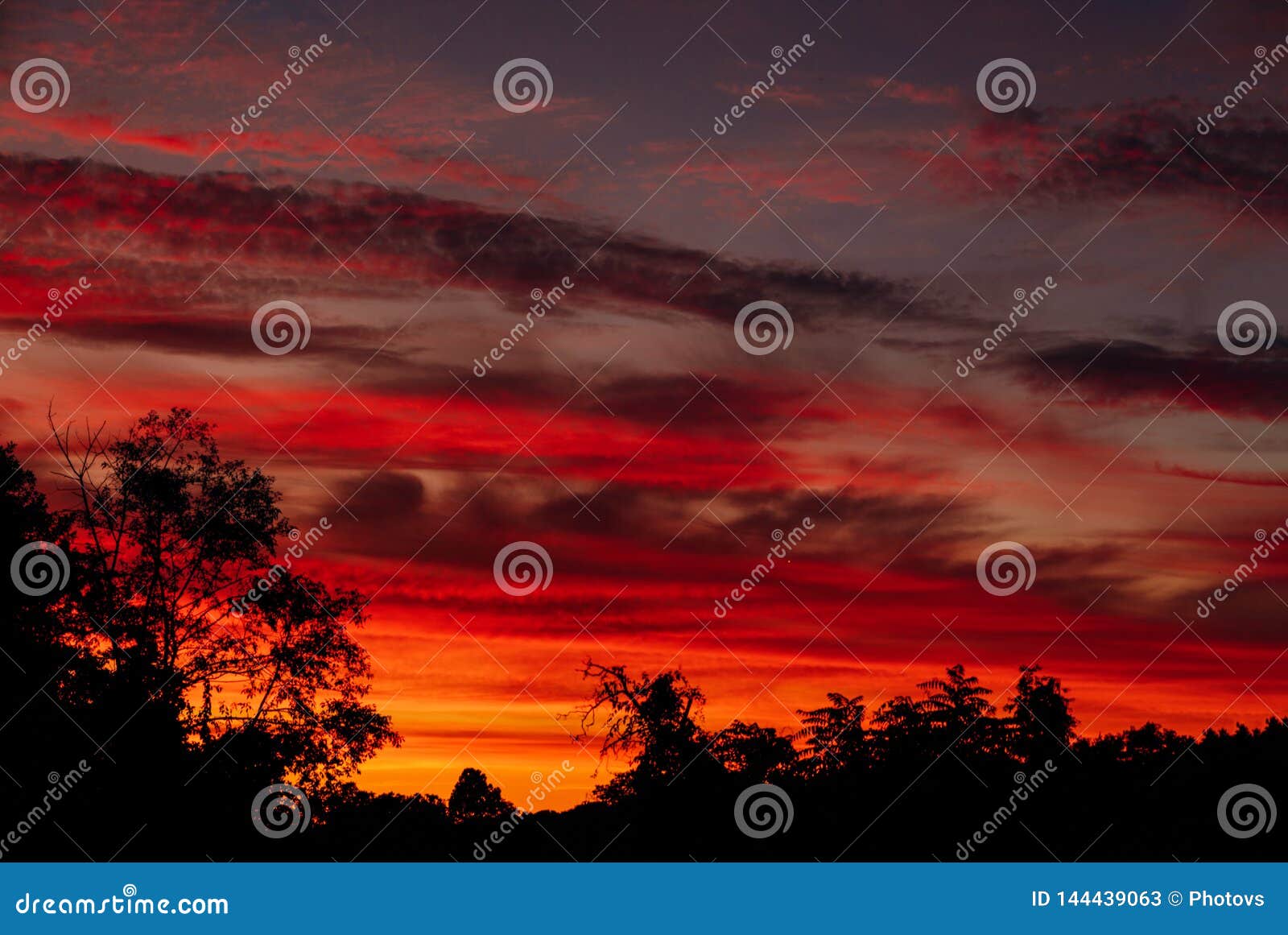Dramatic Sunset with Pink and Purple Clouds and a Blue Sky Stock Image ...