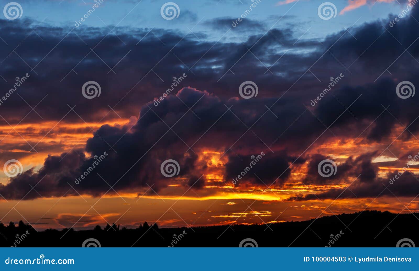 Dramatic Sunset Skies with Fluffy Clouds and Flaming Lights Stock Image ...
