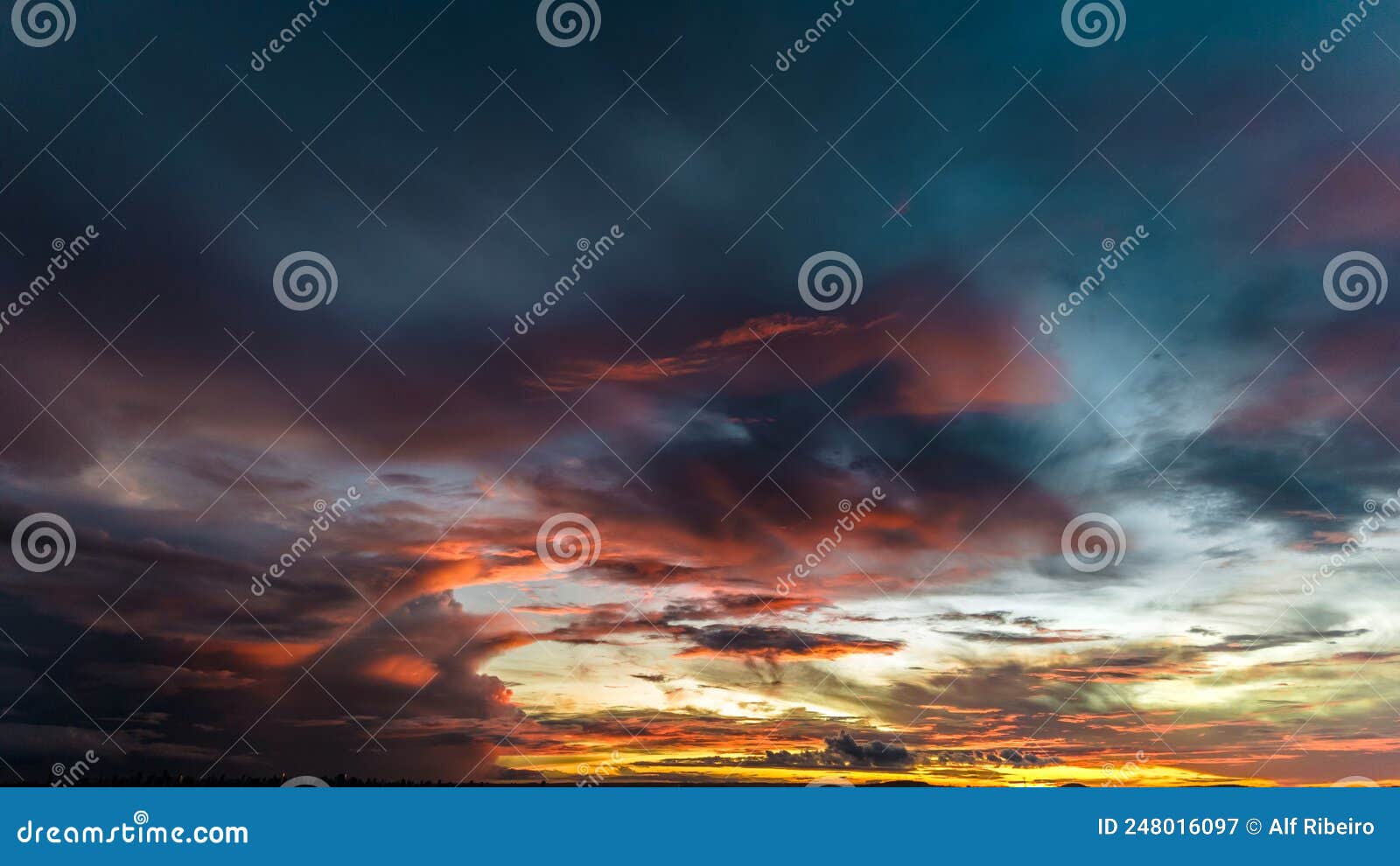 Dramatic Sunset in the Sky through Cumulus Storm Clouds, Stock Image ...