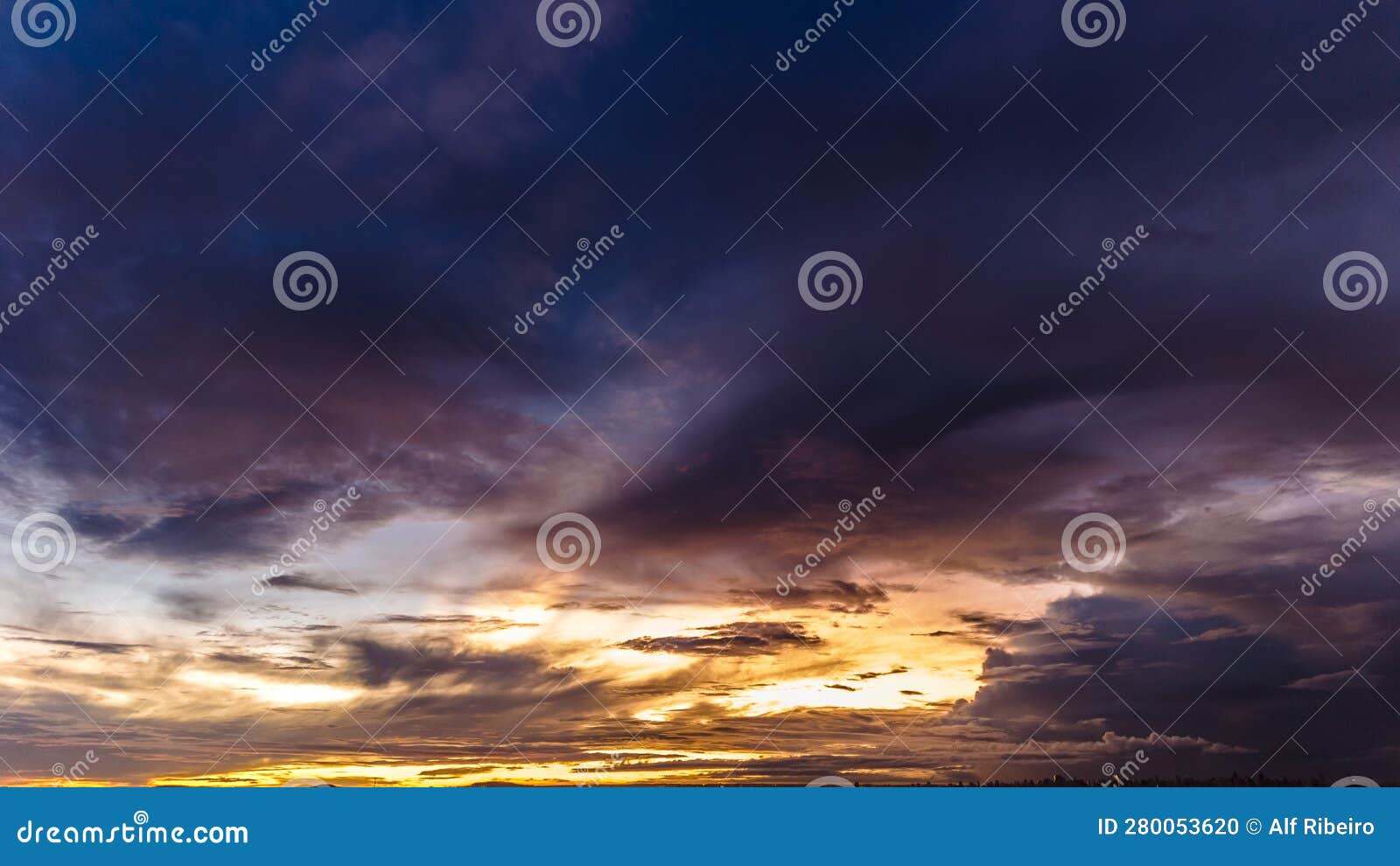 Dramatic Sunset in the Sky through Cumulus Storm Clouds, Stock Photo ...