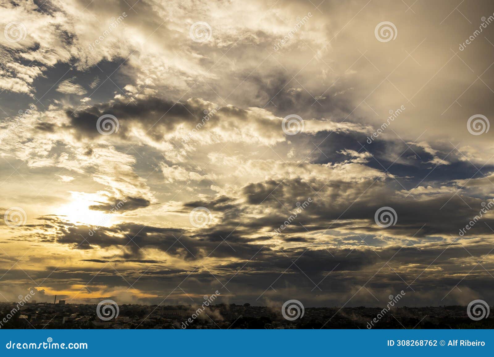 Dramatic Sunset in the Sky through Cumulus Storm Clouds Stock Photo ...