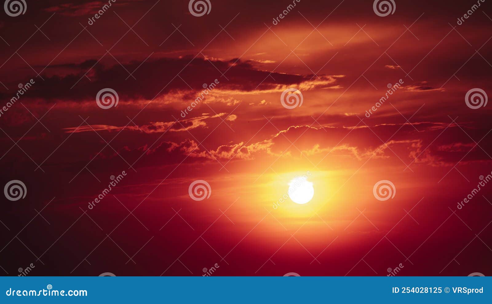 Dramatic Sunset with Sun Rays in Sky through Orange Layered Clouds ...