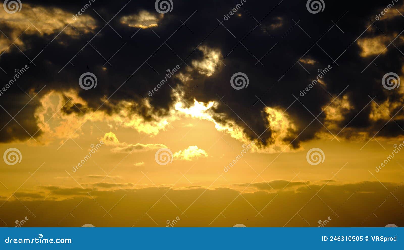 Dramatic Sunset with Sun Rays in Sky through Orange Layered Clouds ...