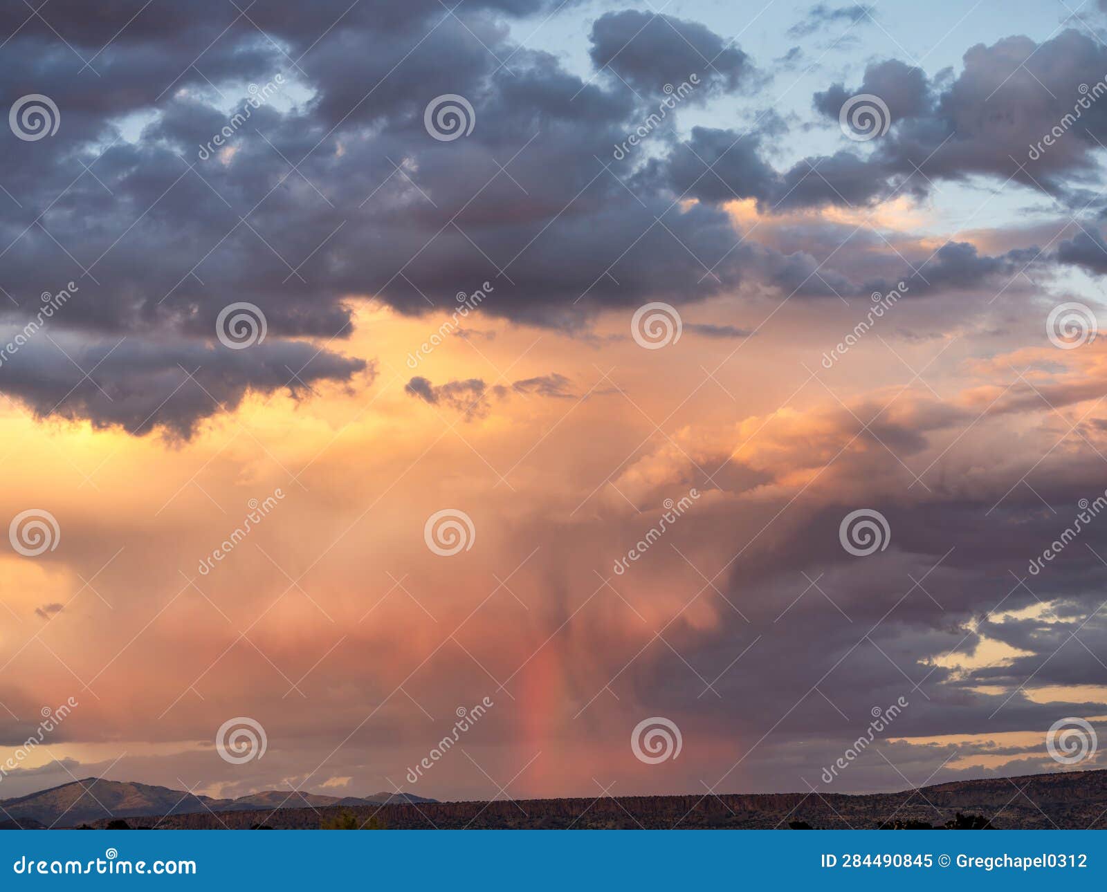 Dramatic Sunset with a Supercell Rainstorm and a Rainbow in the New ...