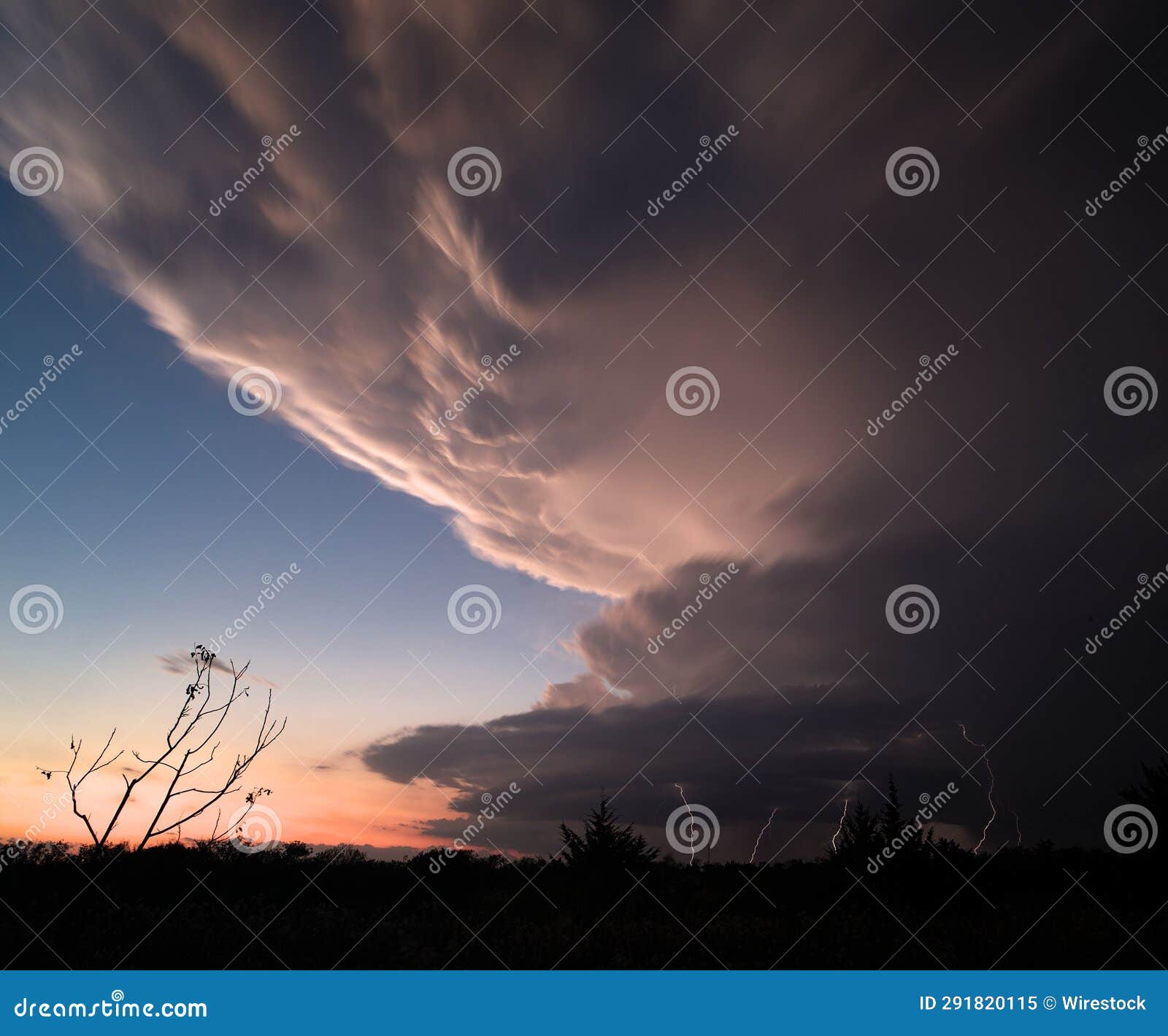 Dramatic Sunset in Texas with a Looming Dark Cloud Illuminated by ...