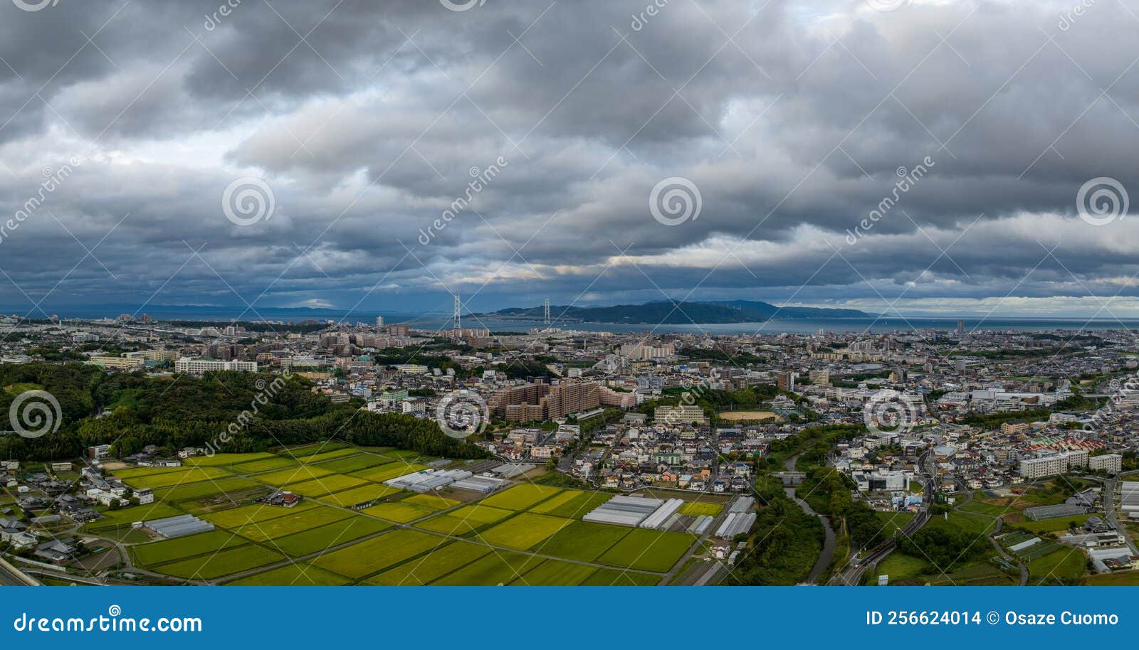 Dramatic Typhoon Clouds Over Rice Fields at Edge of Town Stock Photo ...