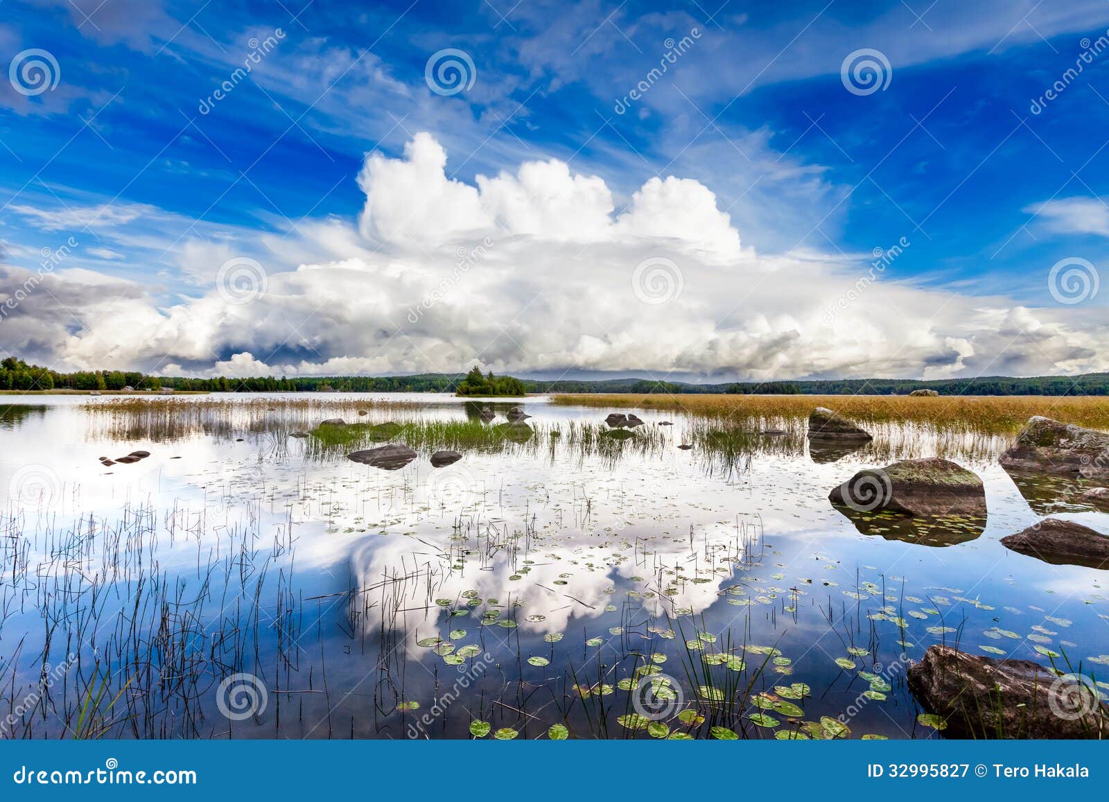 Dramatic White Cloud Over a Bright Blue Lake Stock Image - Image of ...