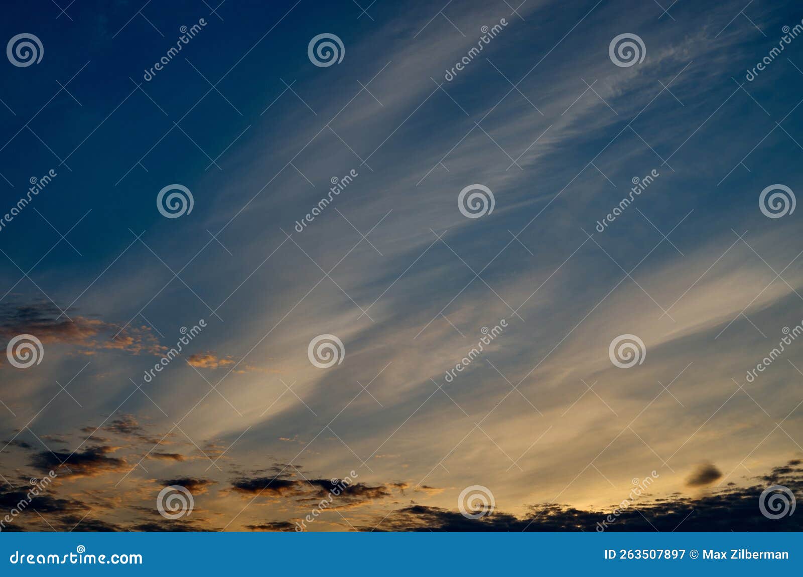 Dramatic Yellow and Orange Sunset Sky with Clouds and Sun Rays Stock ...