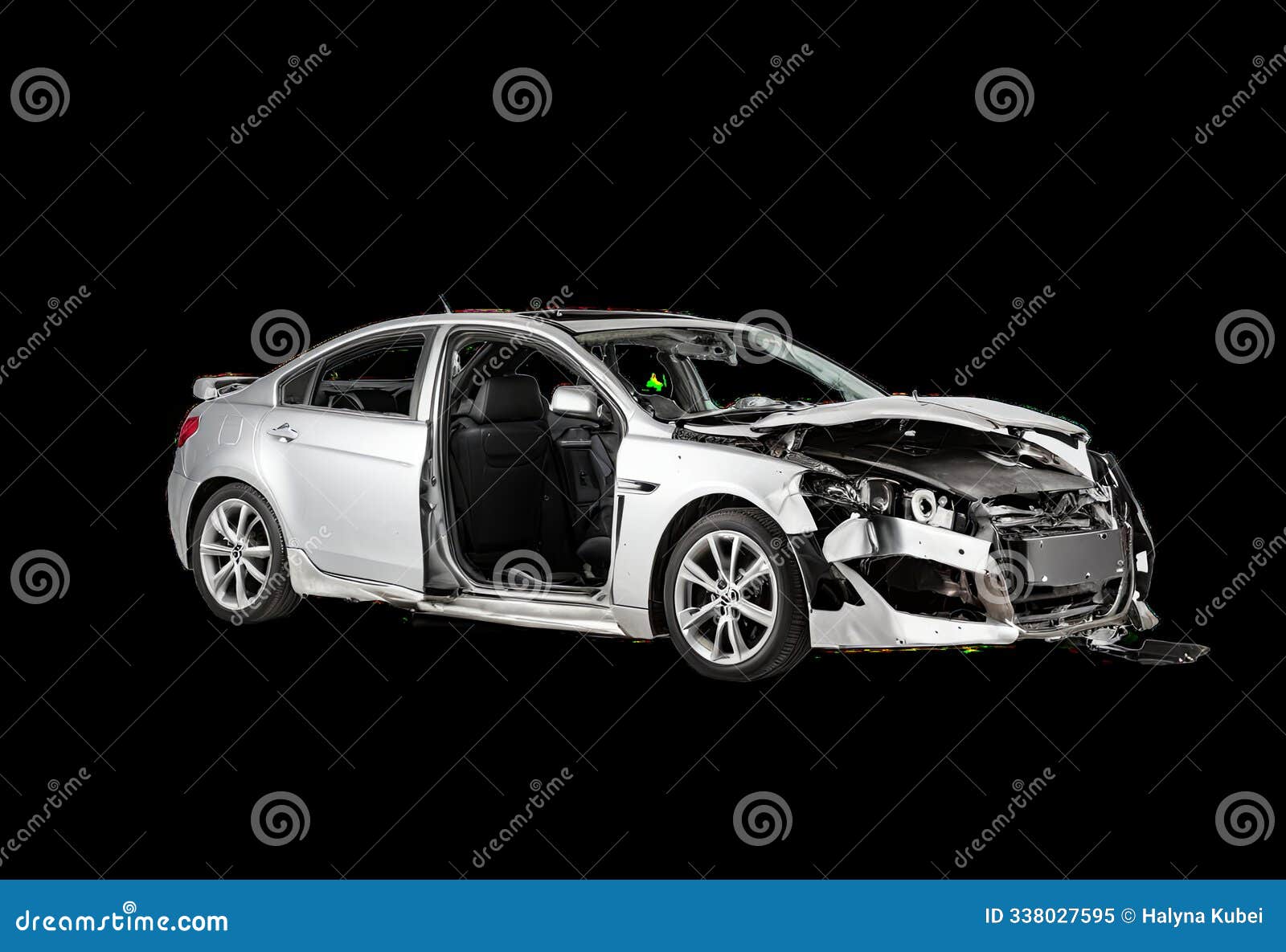 A Dramatically Crashed Silver Sedan with Open Doors and a Visible ...