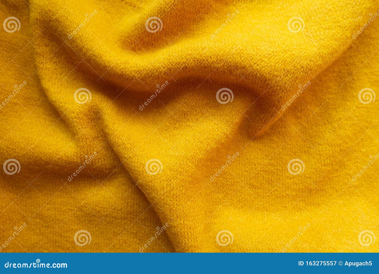 Draped Bright Amber Yellow Knitted Woolen Fabric Stock Image - Image of ...