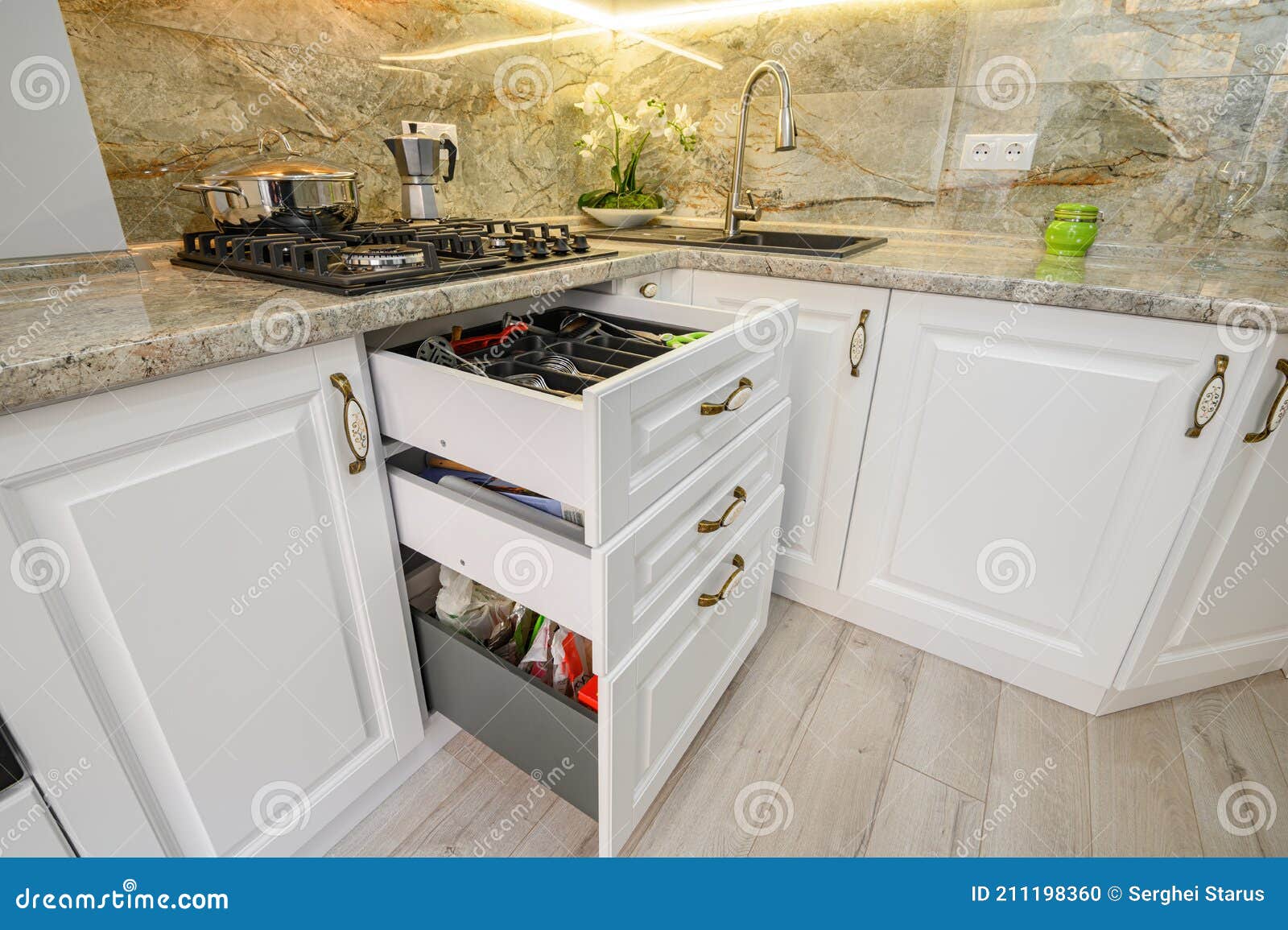 Drawers Pulled Out at Modern Classic White Kitchen Furniture Stock ...