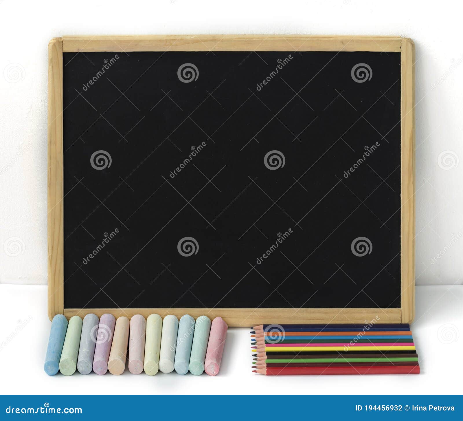 Drawing Board with Pencils and Crayons on a White Background with a ...