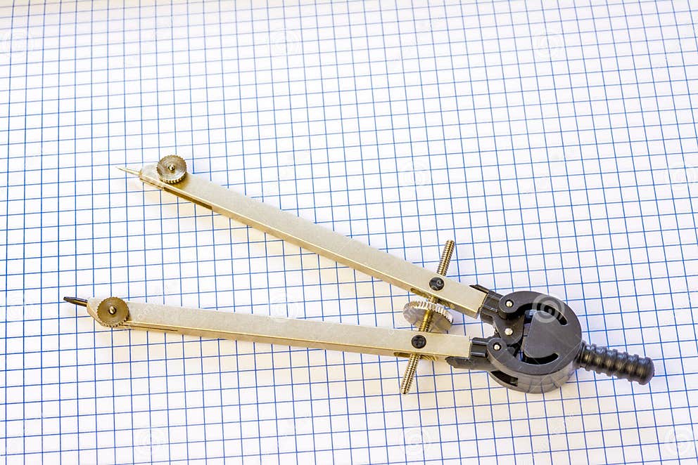 Drawing Compass in Graph Paper Stock Photo - Image of office, tools ...