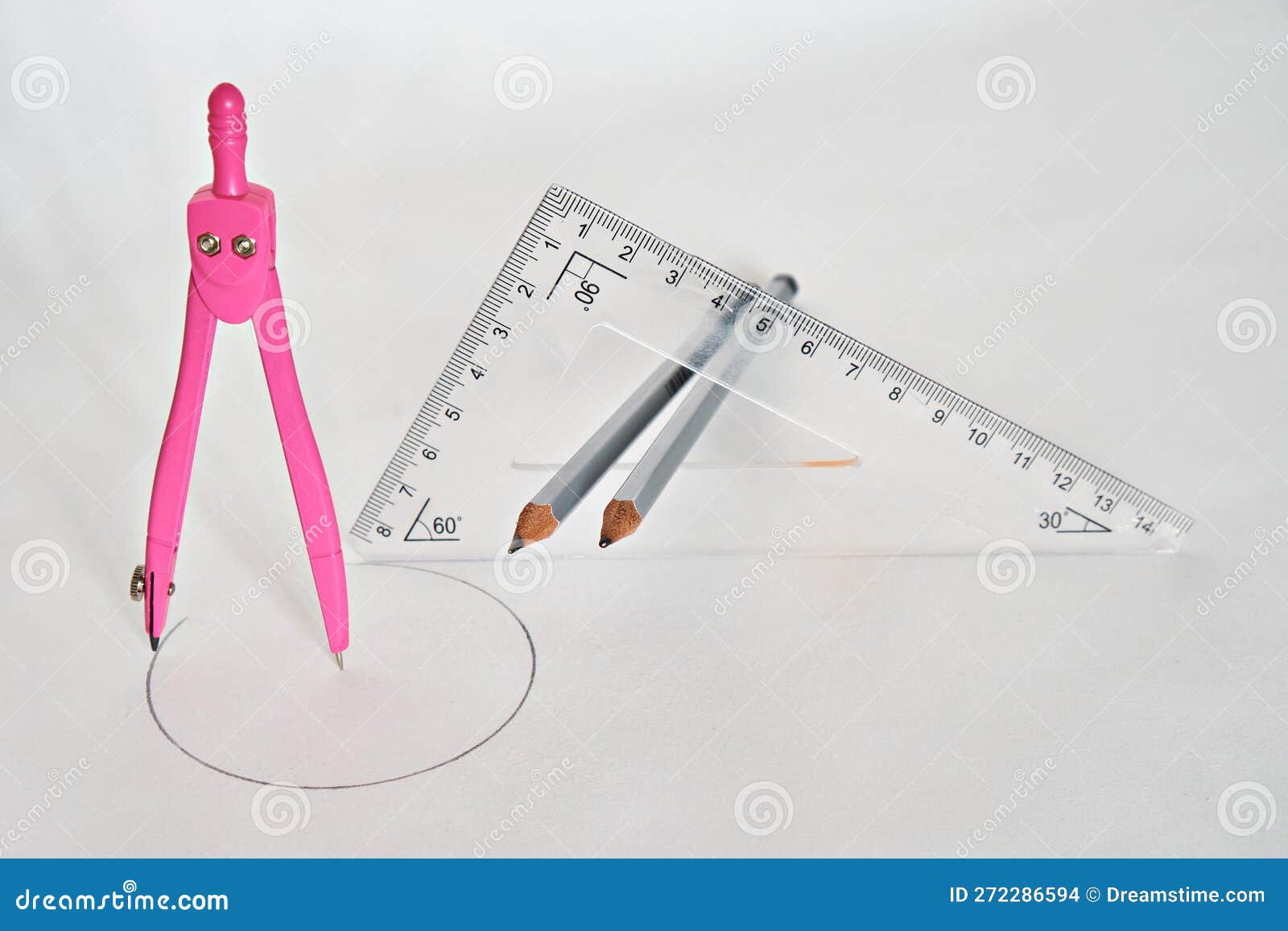 A Drawing Compass and a Triangular Ruler with Two Pencils in the Middle ...