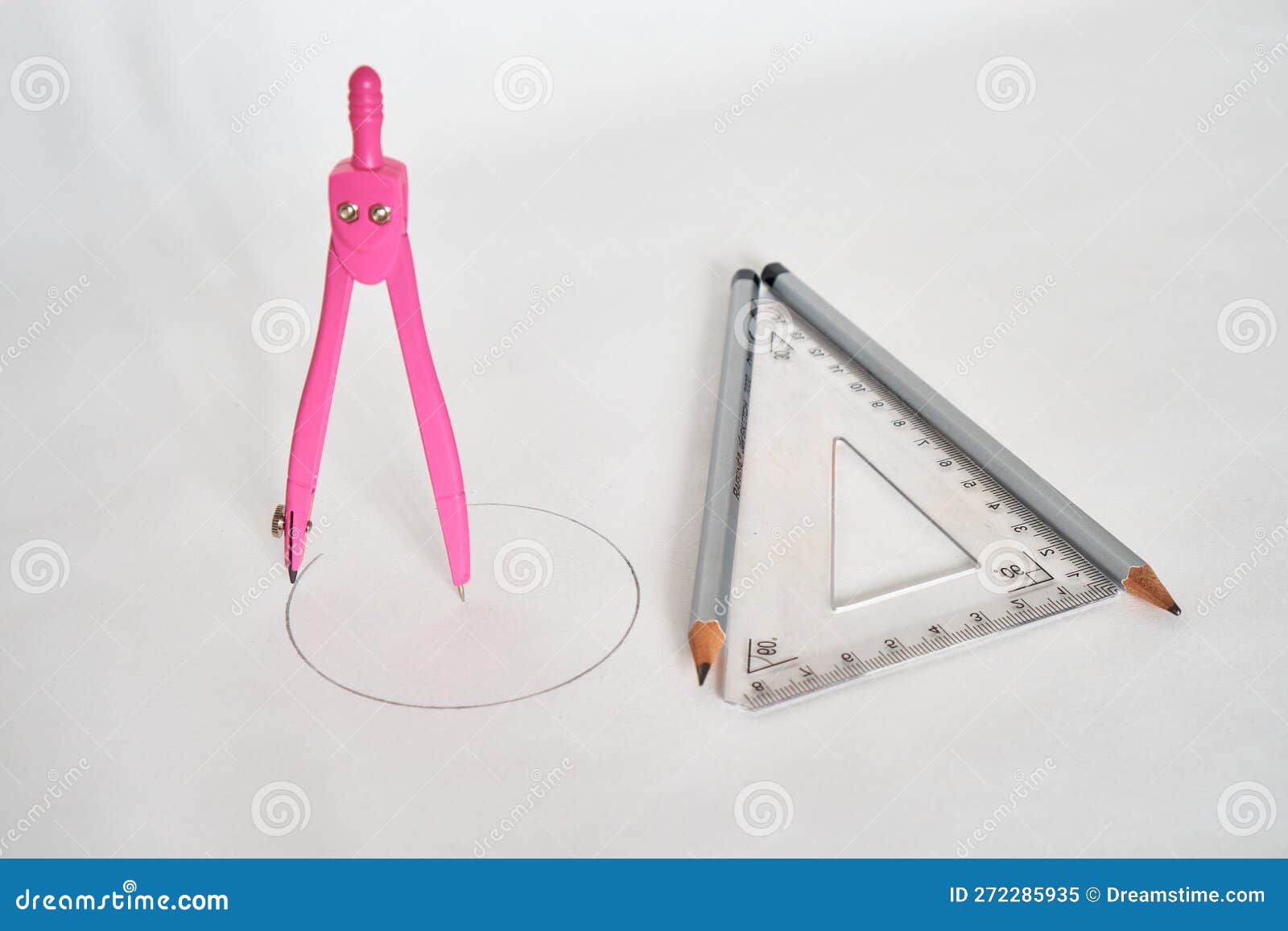 Drawing Compass and Triangular Ruler with Two Pencils on a White ...