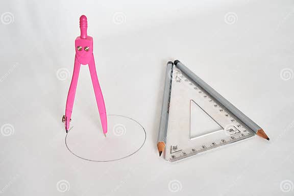Drawing Compass and Triangular Ruler with Two Pencils on a White ...