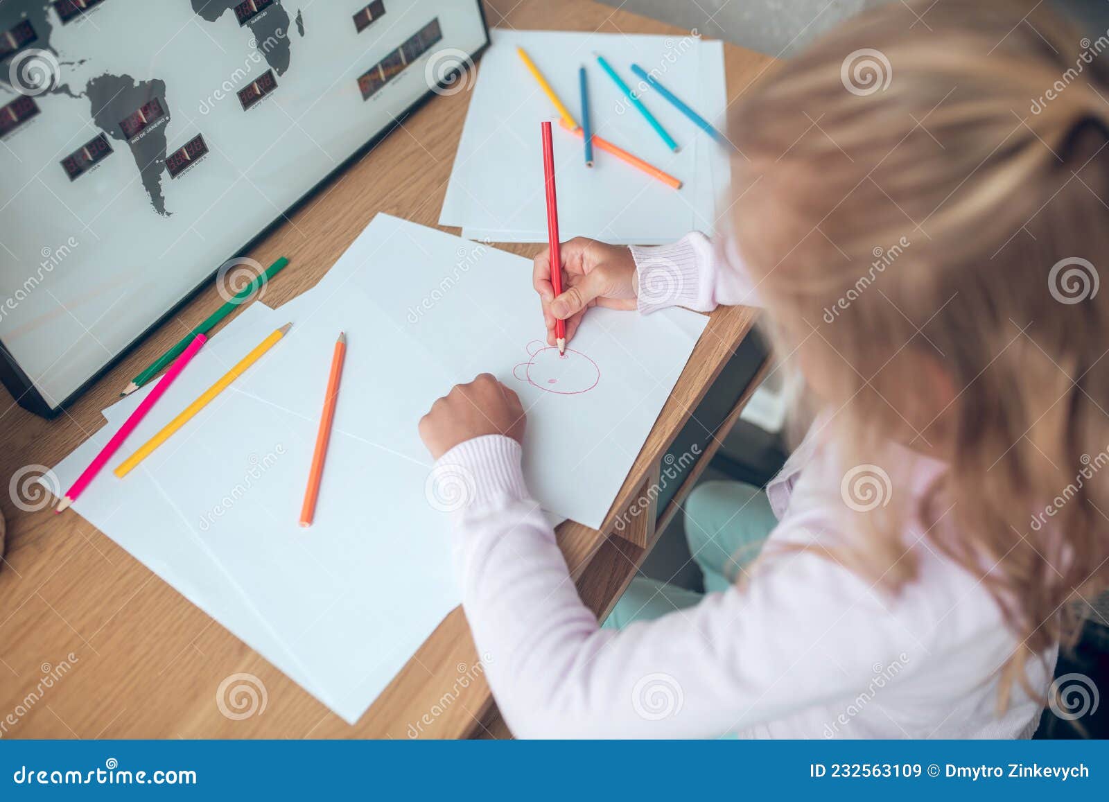 A Cute Girl Sitting at the Table and Drawing Stock Image - Image of ...