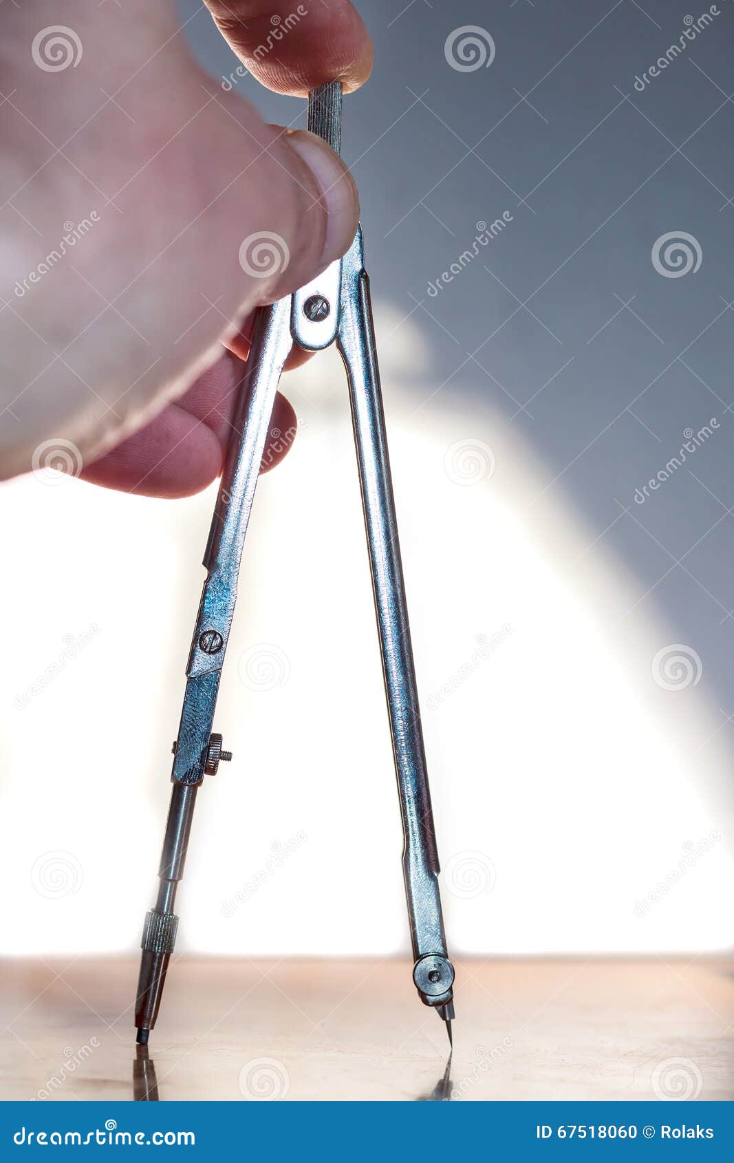 Drawing dividers in hand stock photo. Image of geometric - 67518060