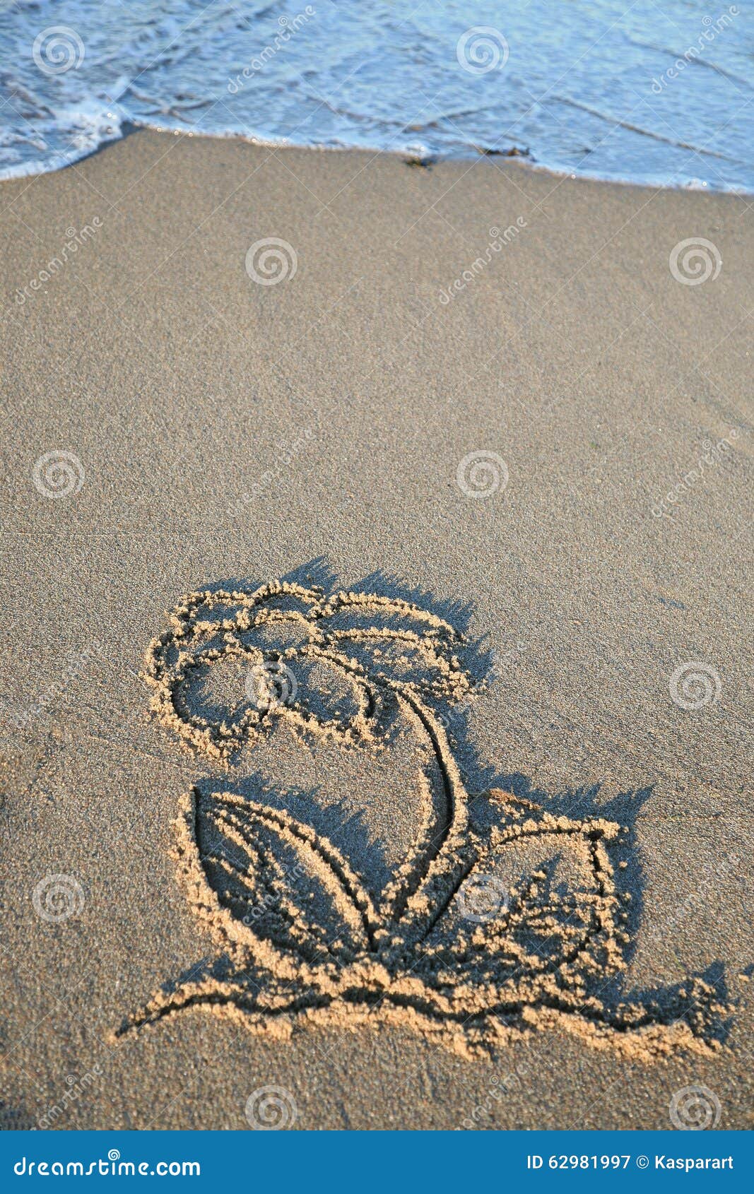 Drawing of a Flower As a Symbol in the Sand of a Beach Stock Image ...