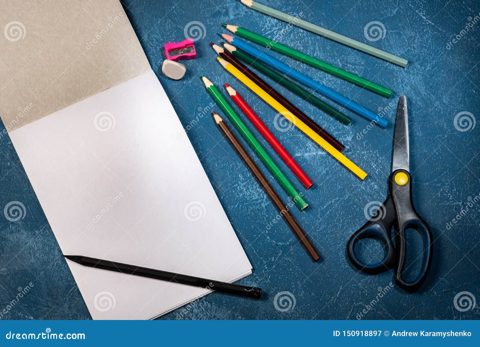 Drawing Pad and Colored Pencils on Blue Background Stock Image - Image ...