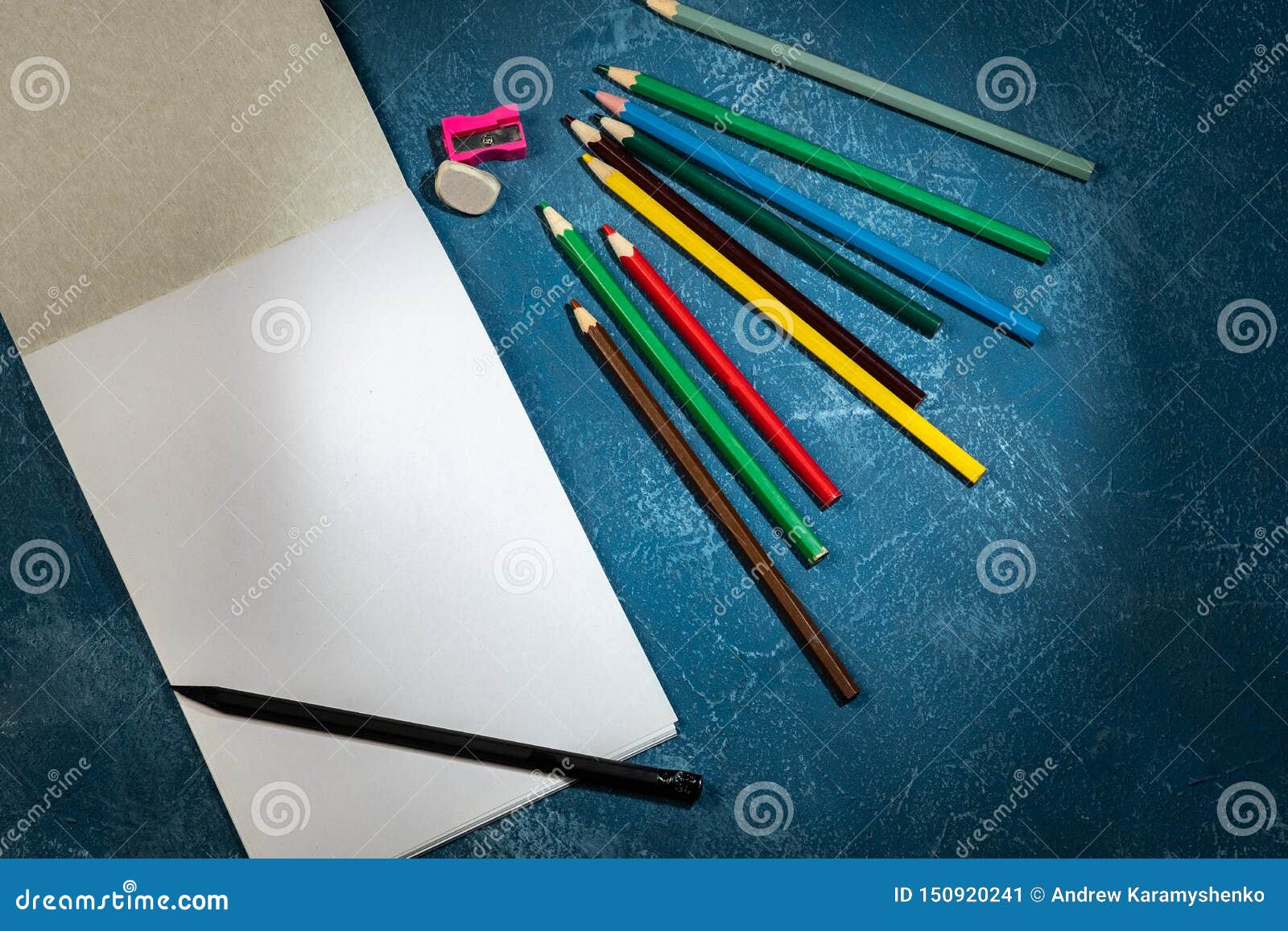 Drawing Pad and Colored Pencils on Blue Background Stock Image - Image ...