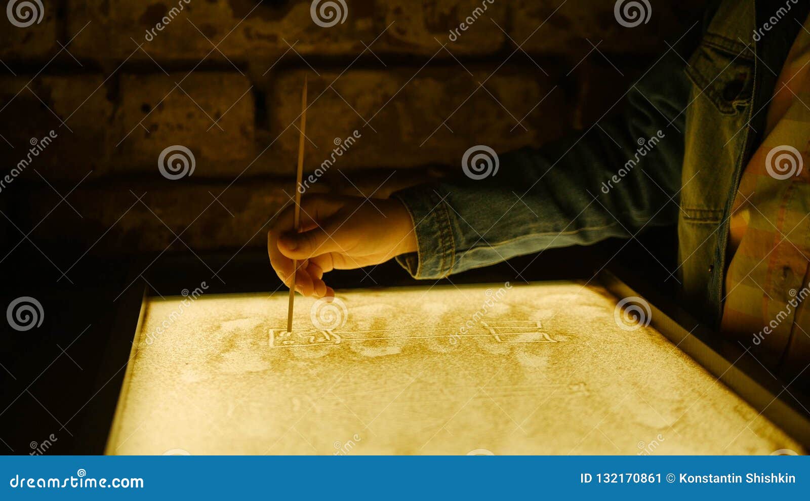 Drawing with a Sand on the Screen with a Stick Stock Image - Image of ...
