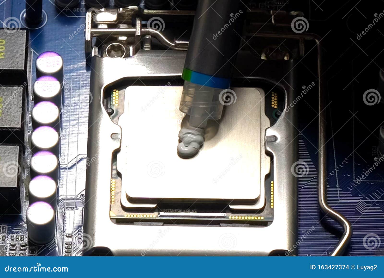 Drawing Thermal Paste on Computer Processor. Installing a Cooling ...