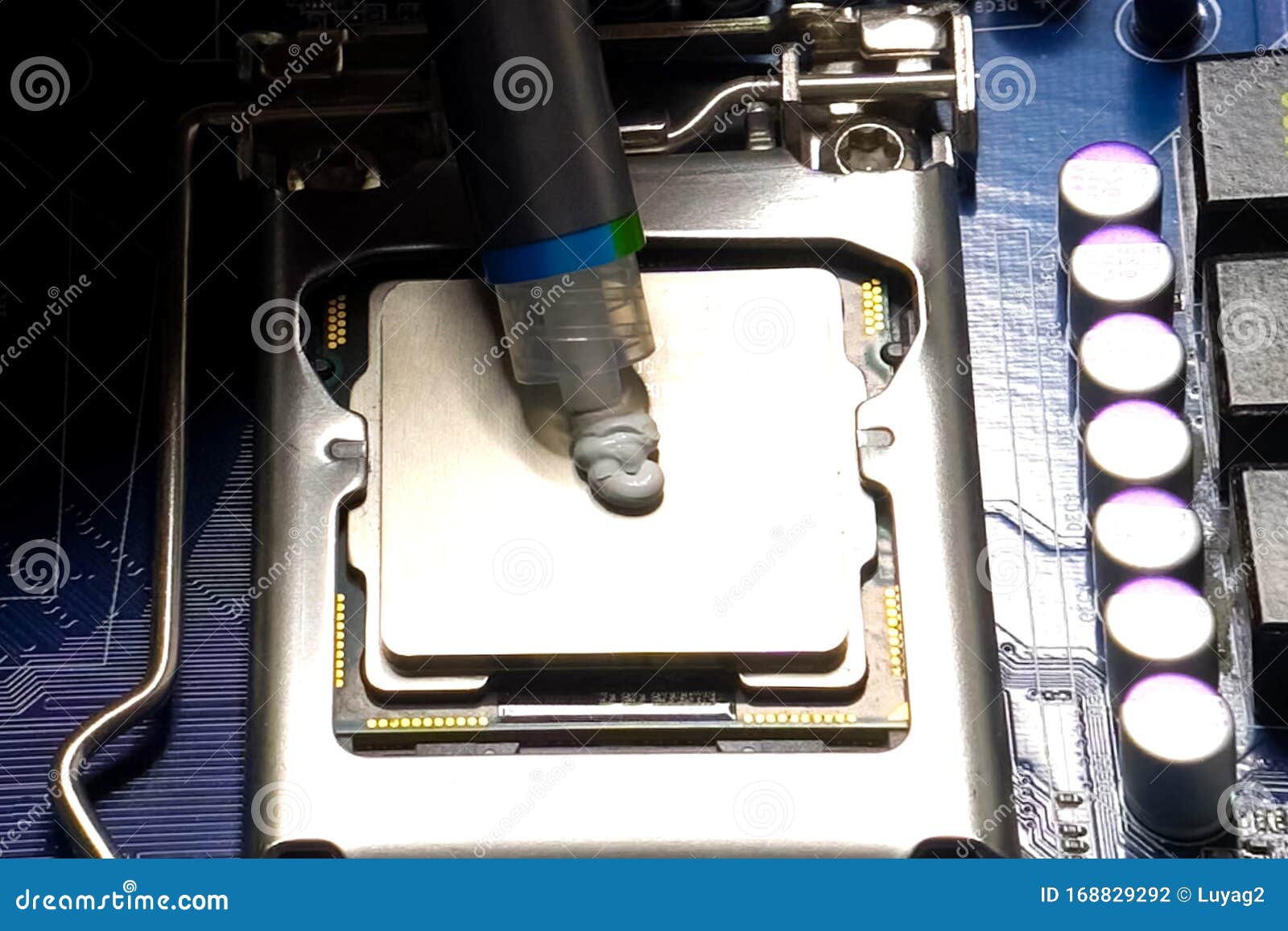 Drawing Thermal Paste on Computer Processor. Installing a Cooling ...