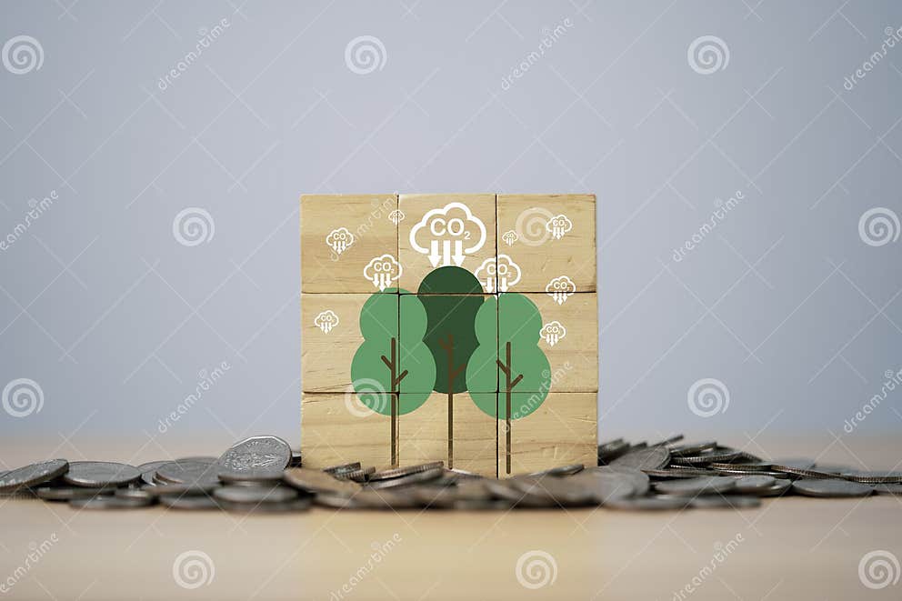 Drawing of Tree and CO2 Reduction Icon Print Screen on Wooden Block Cube and Heap of Coins for ...