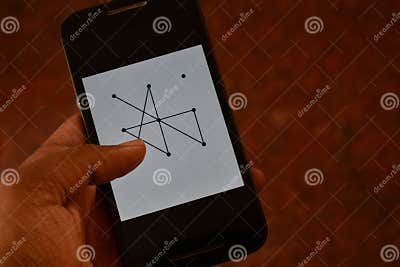 Drawing Unlock Pattern on a Smart Phone. Concept about Smart Phone ...