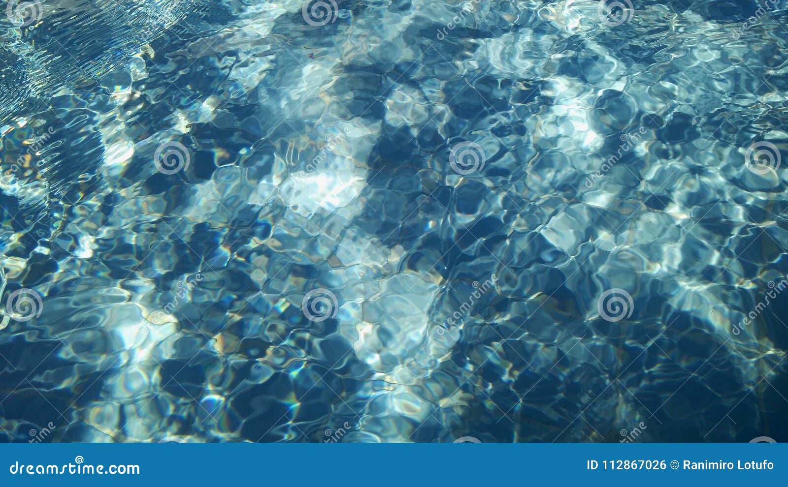 Drawings on the Wave of Water in Blue Swimming Pool Stock Photo - Image ...