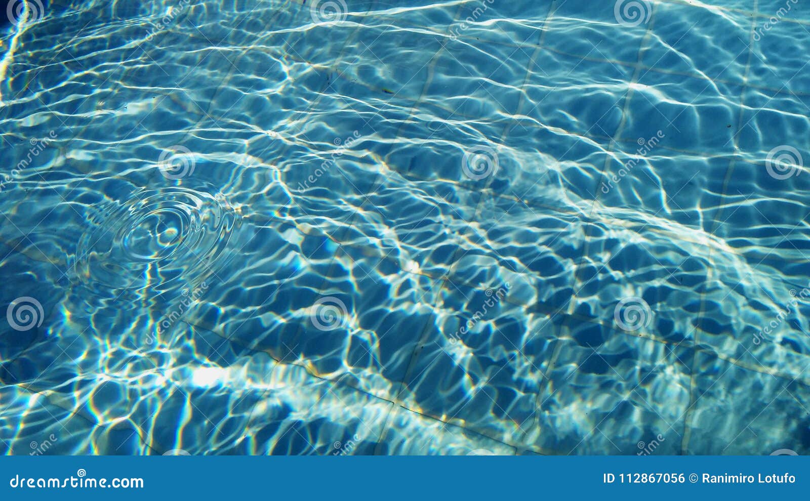 Drawings on the Wave of Water in Blue Swimming Pool Stock Photo - Image ...