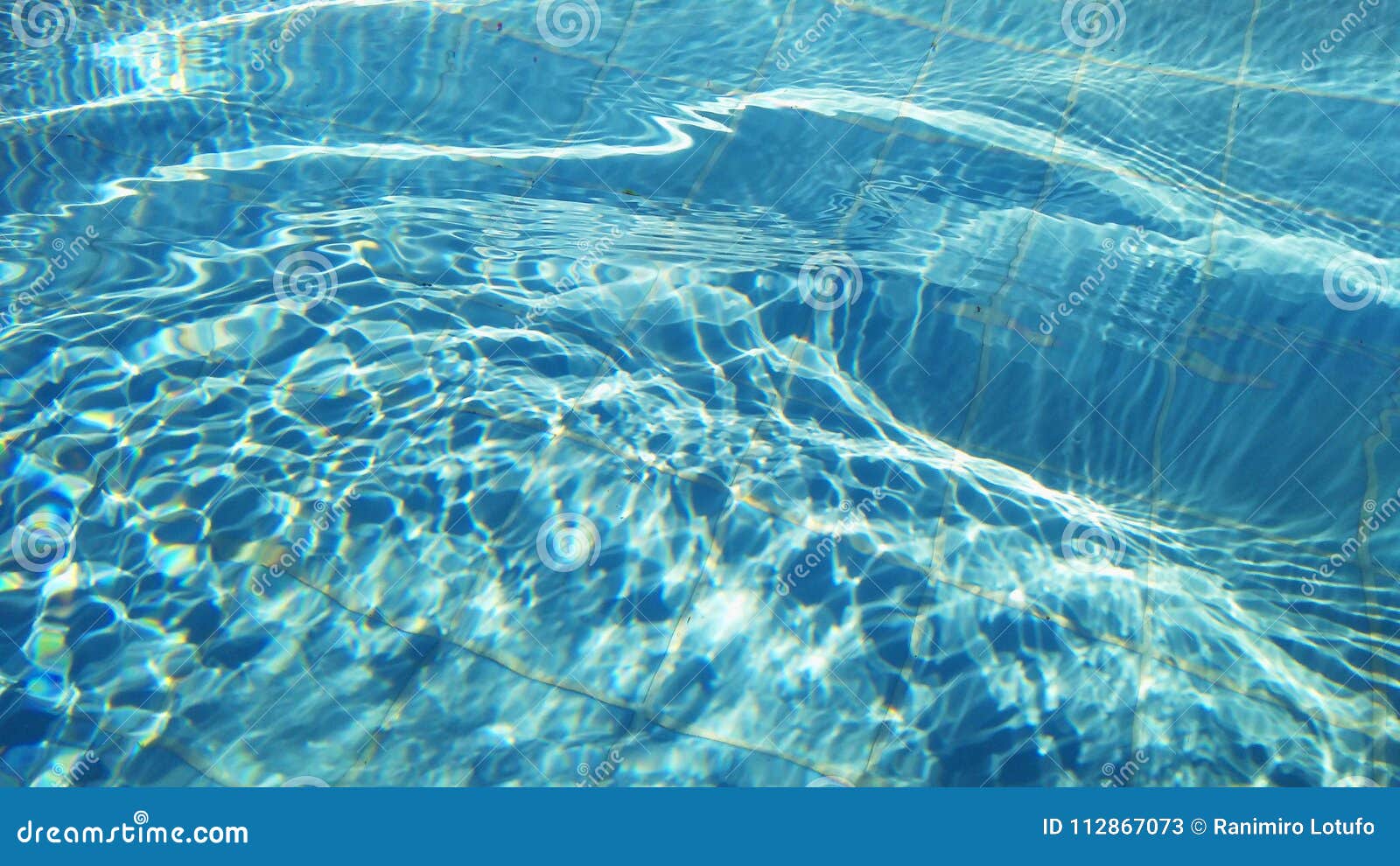 Drawings on the Wave of Water in Blue Swimming Pool Stock Image - Image ...
