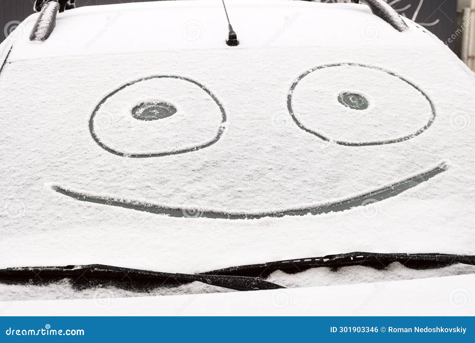 Drawn Smile Face on a Snow Covered Windshield of a Car Stock Photo ...